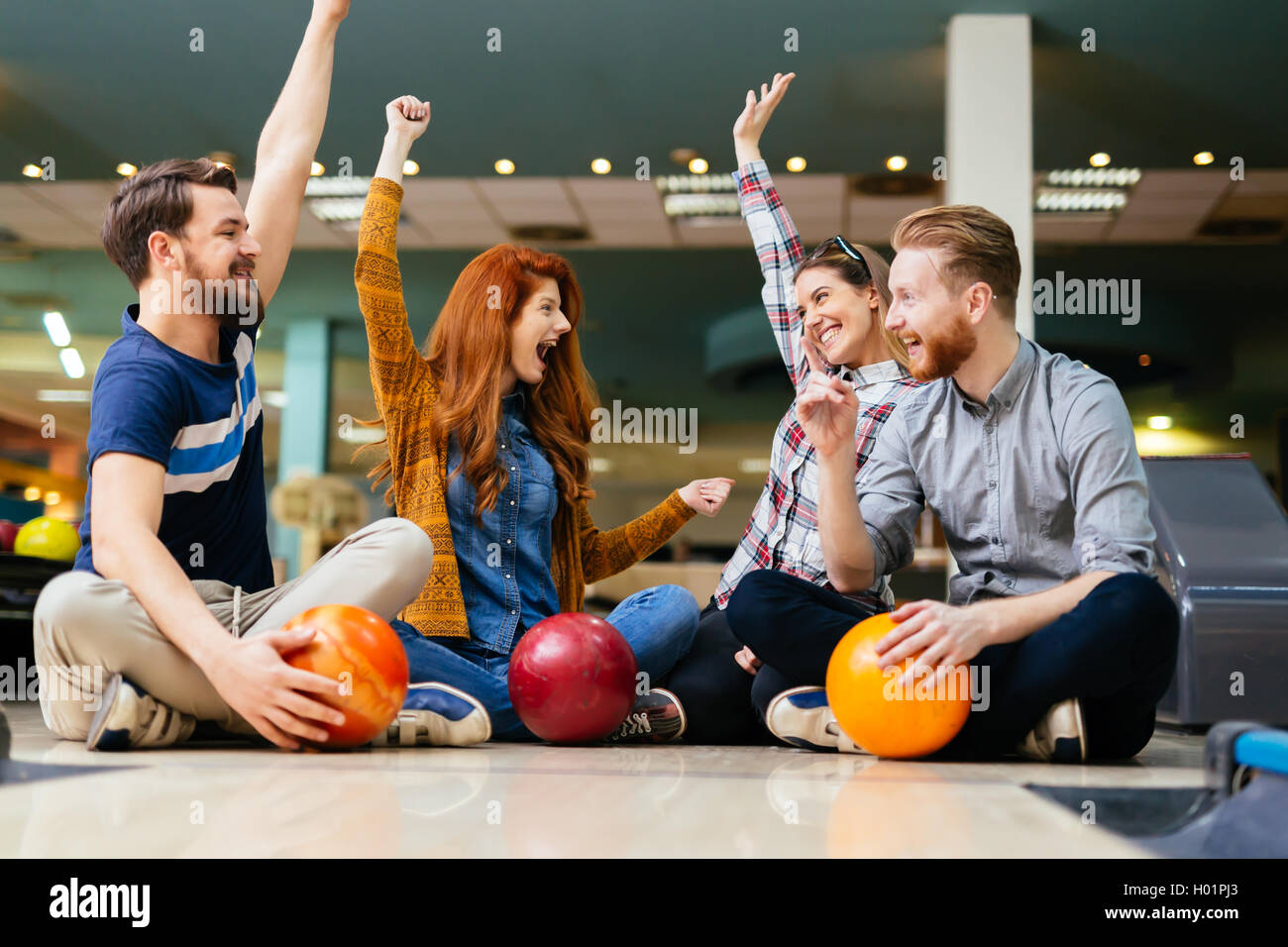 Cheerful friends bowling together and bonding Stock Photo - Alamy