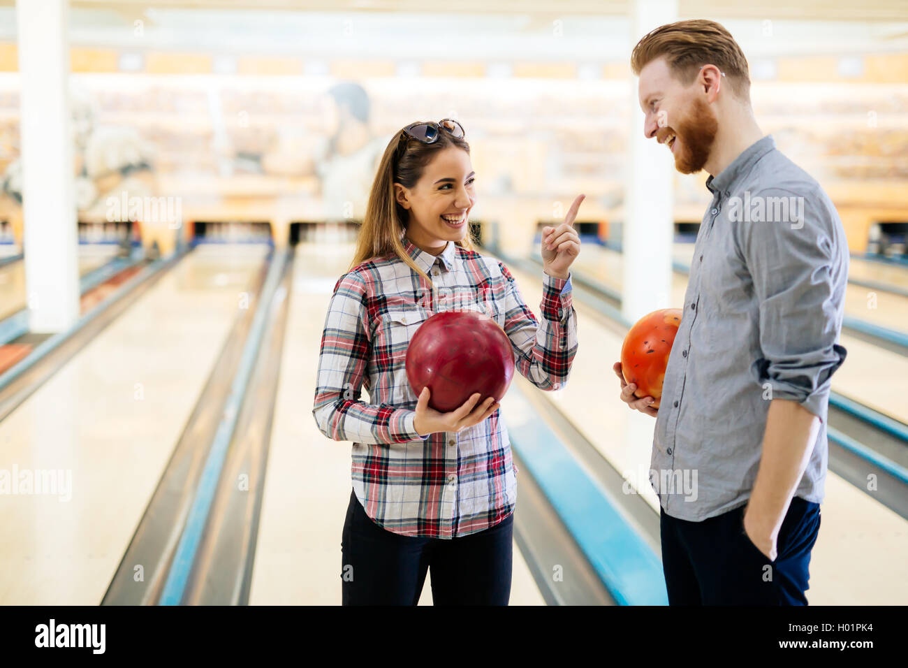 Dating couple enjoy bowling together Stock Photo - Alamy