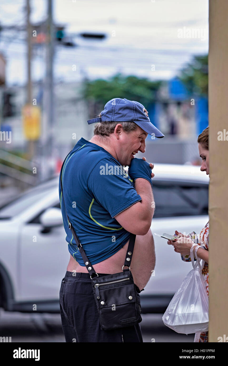 Overweight male with exposed midriff Stock Photo - Alamy