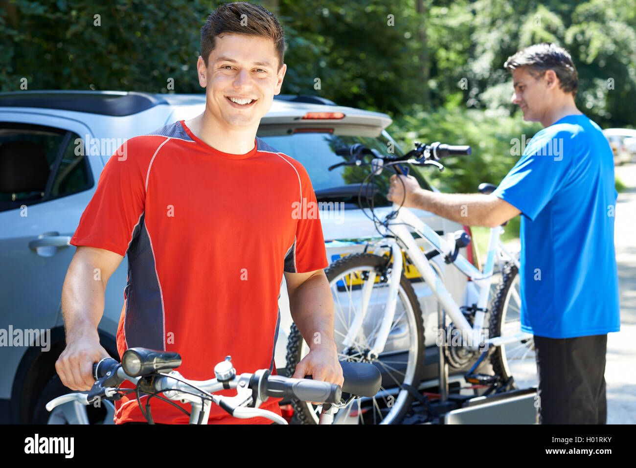Two Men Going On Cycle Ride Together Stock Photo - Alamy