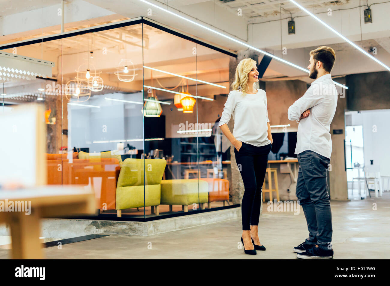 Conversation between two colleagues hi-res stock photography and images ...