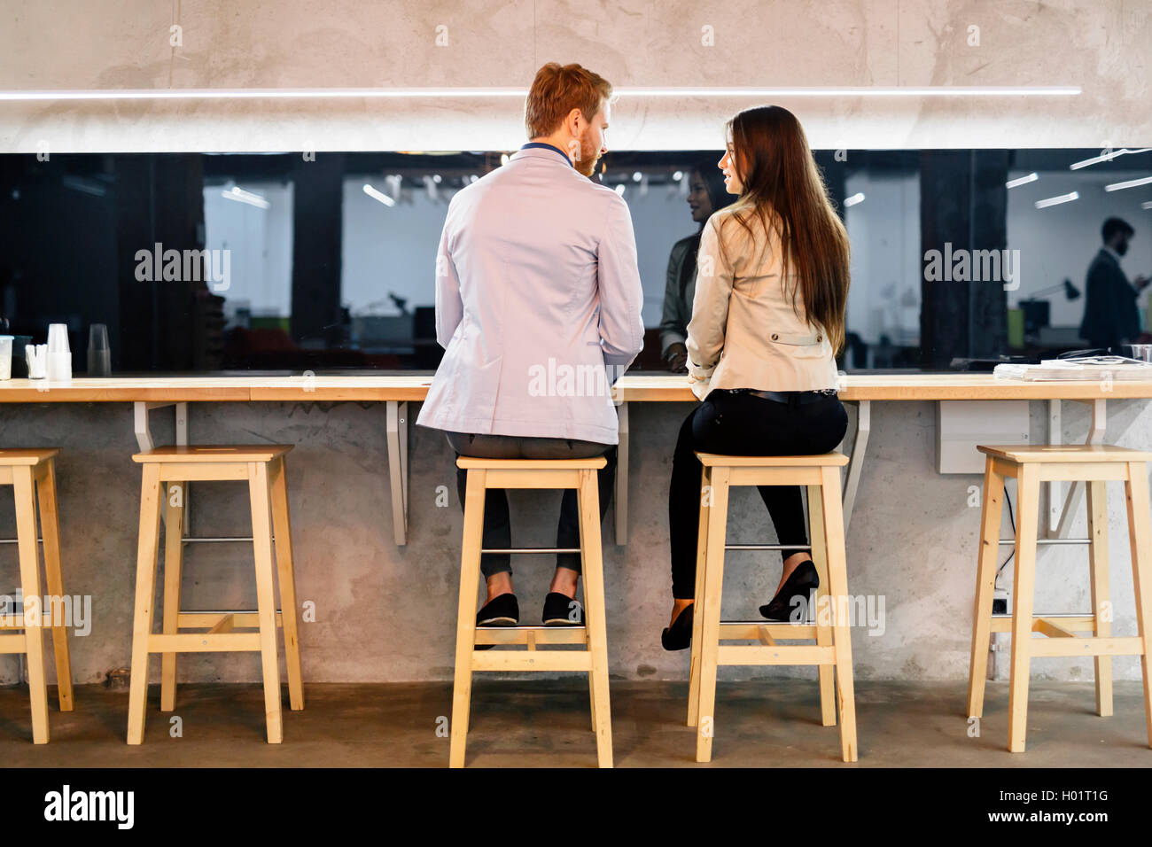 Handsome man initiating a conversation in a bar Stock Photo - Alamy