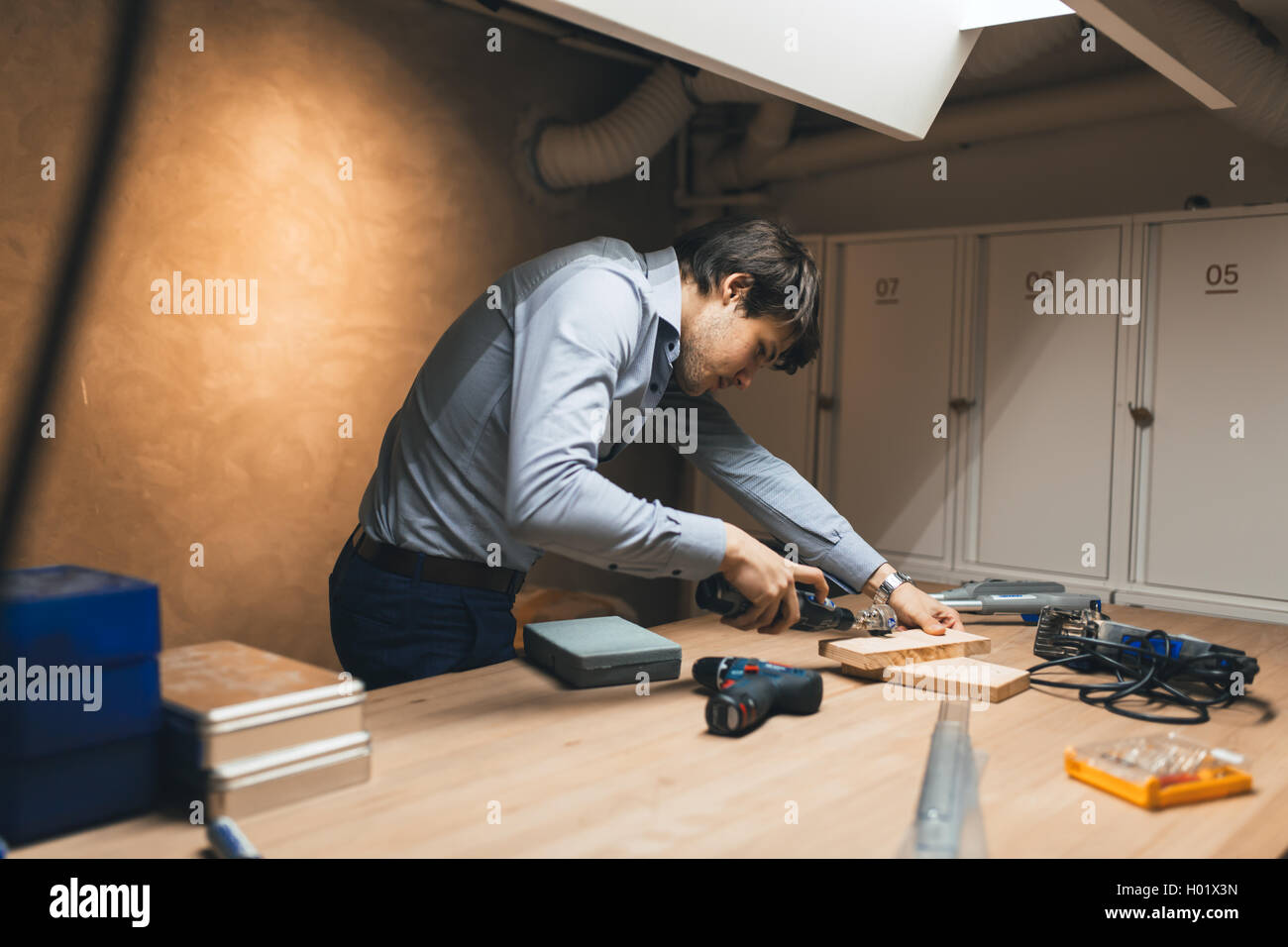 Handyman working with wood with precision tools at hand Stock Photo - Alamy