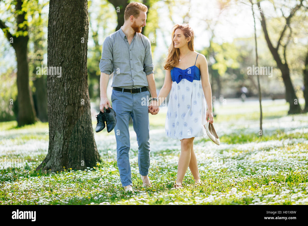 Romantic couple walking forest barefoot hi-res stock photography and ...