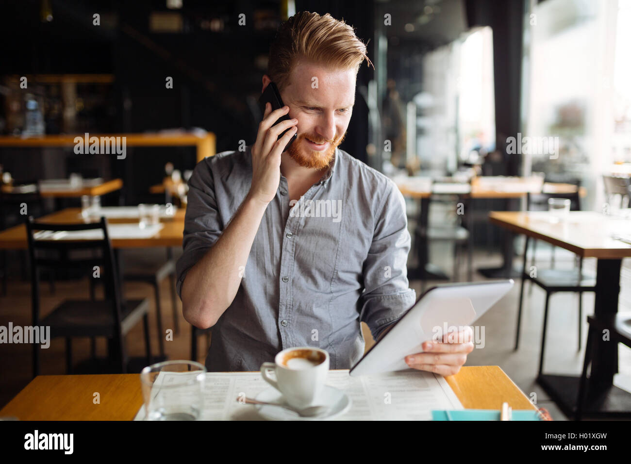 Businessman constantly busy and working Stock Photo - Alamy
