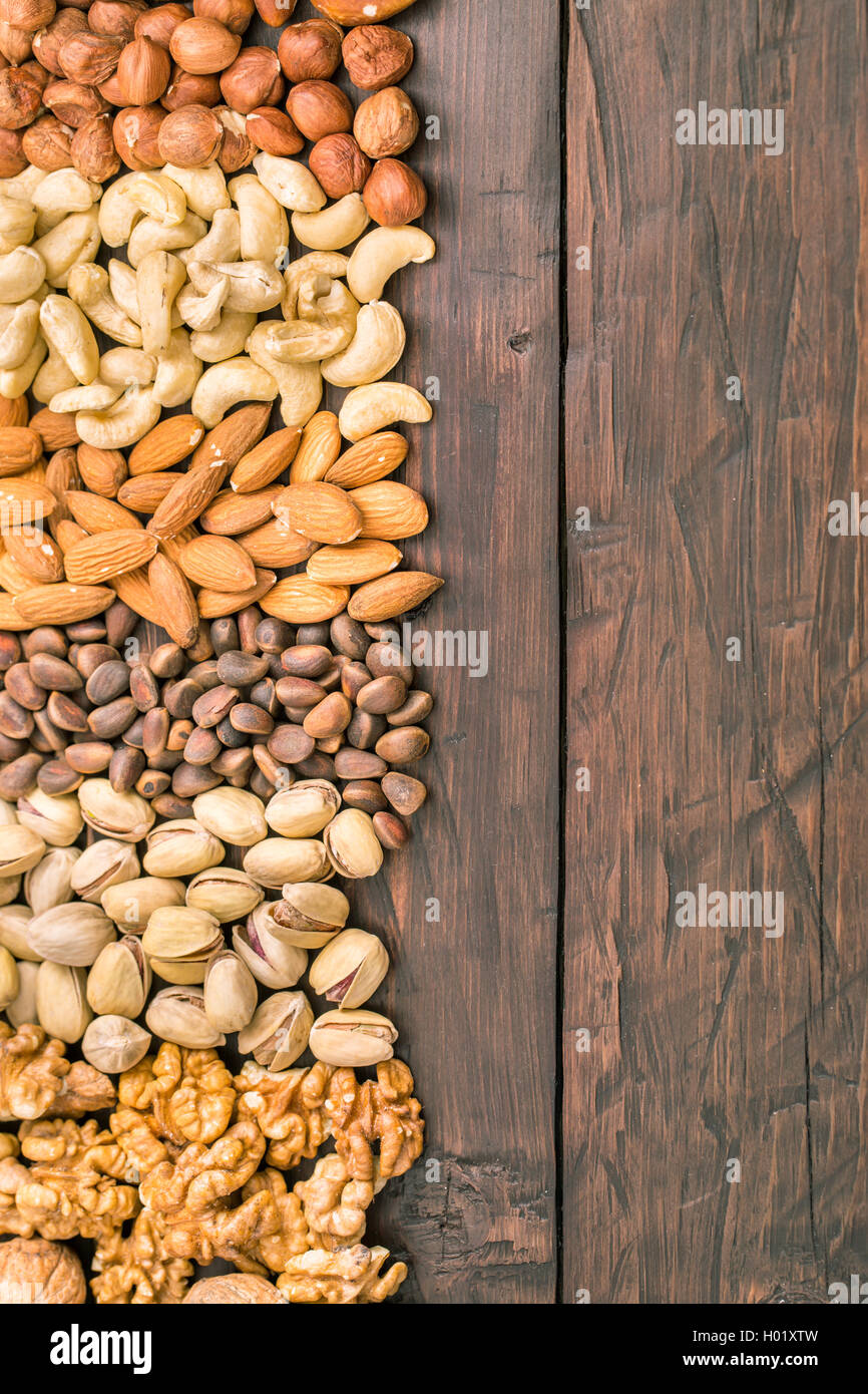 Nuts background from left side Stock Photo - Alamy