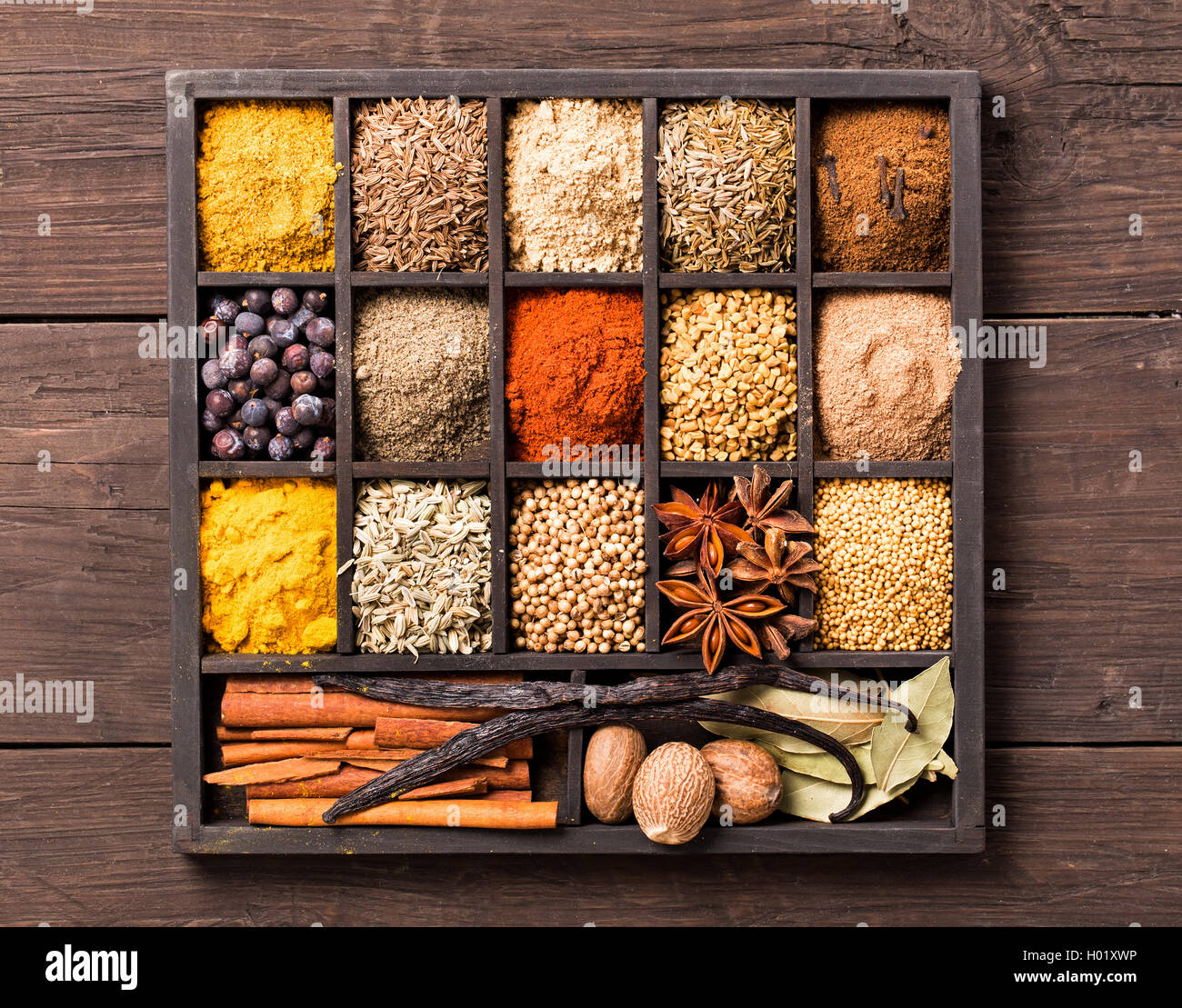 Various herbs and powder spices in box Stock Photo - Alamy