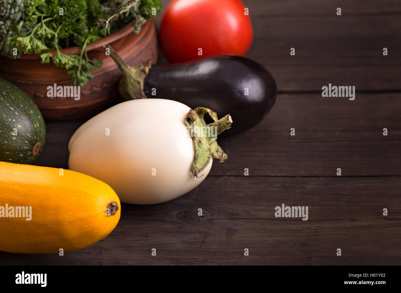 Various vegetables at left side of table Stock Photo - Alamy