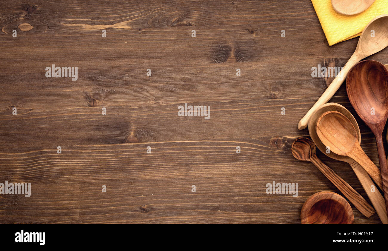 Various wooden spoons at right of wooden table background Stock Photo ...