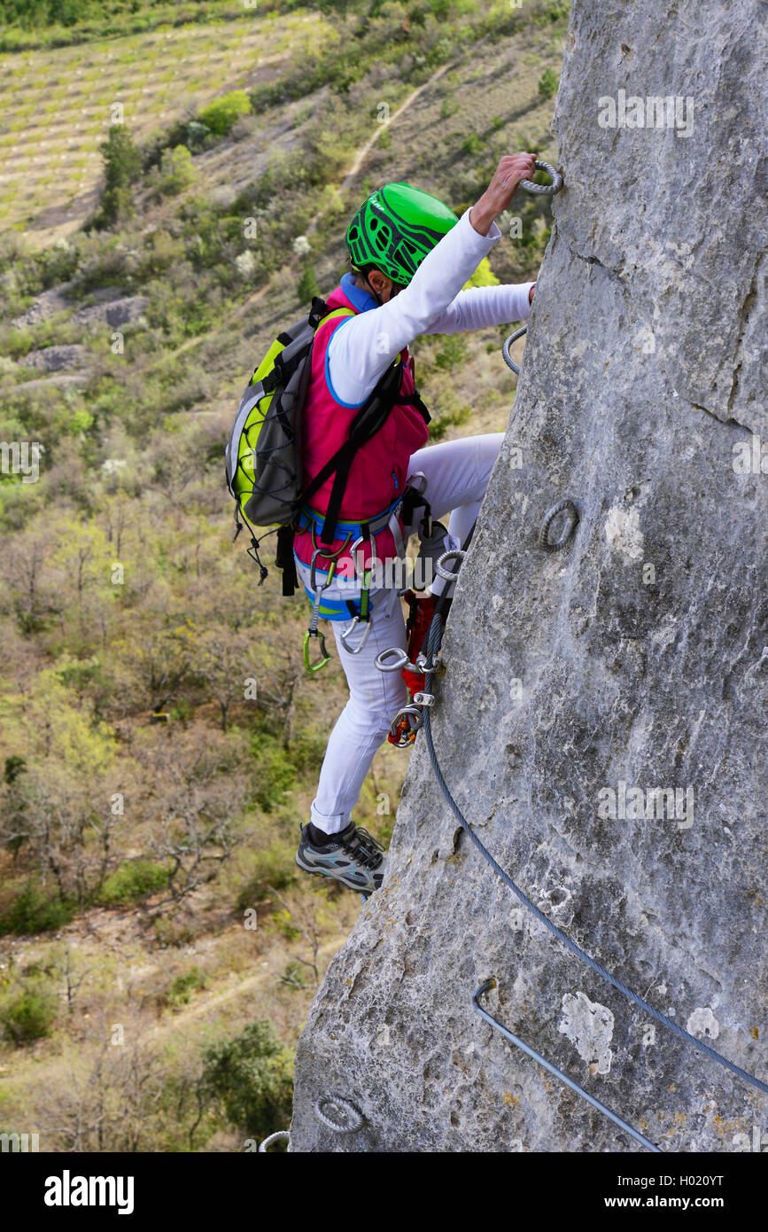 female climber at rock wall, Via Ferrata de Buis les Baronnies, Rocher ...