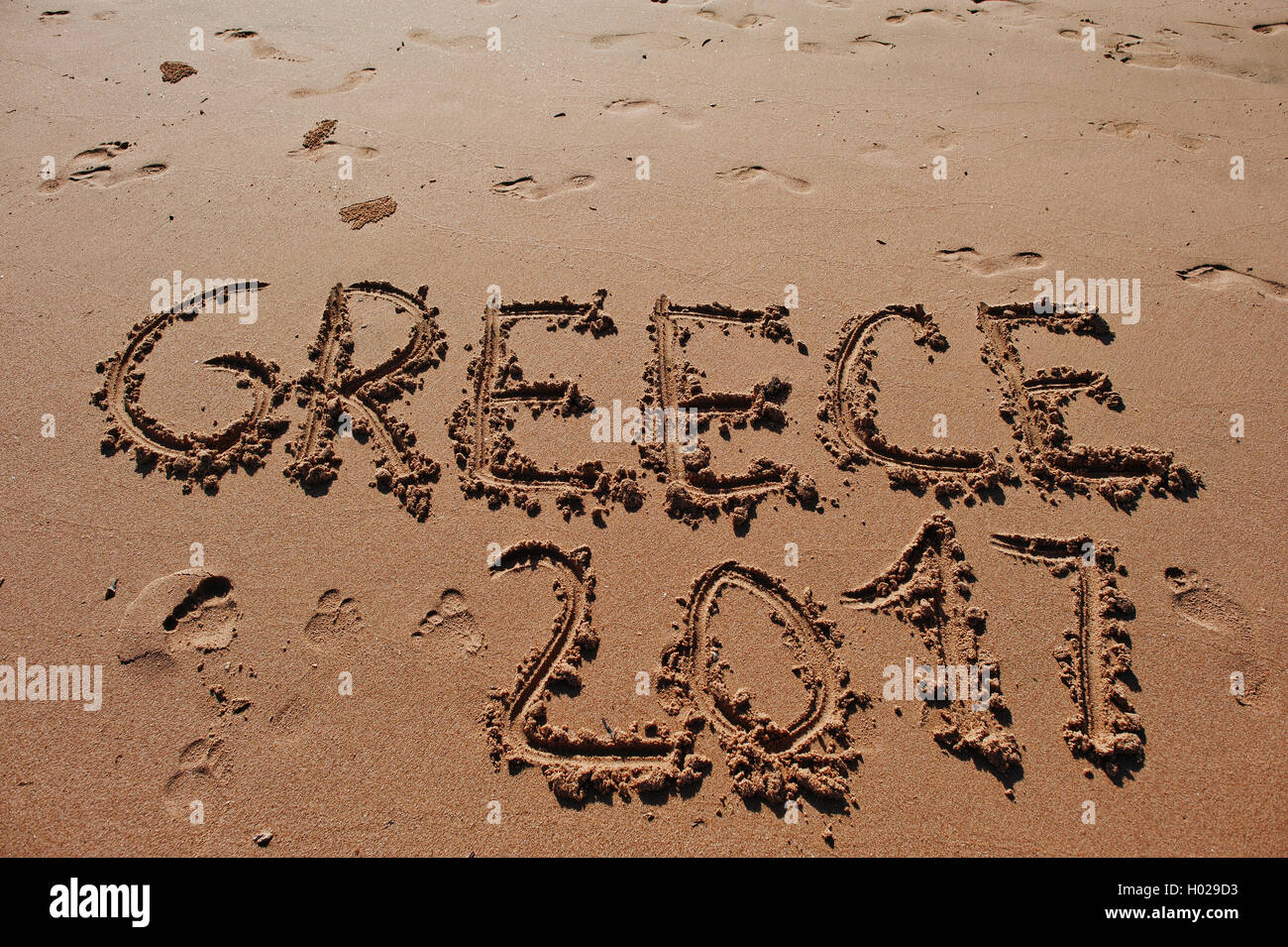 "Greece 2017" written in the sand on the beach Stock Photo - Alamy