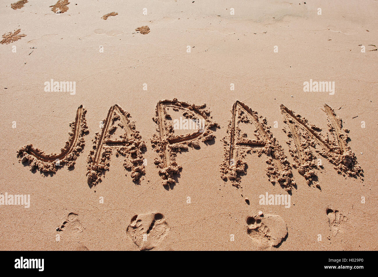 "Japan" written in the sand on the beach Stock Photo - Alamy