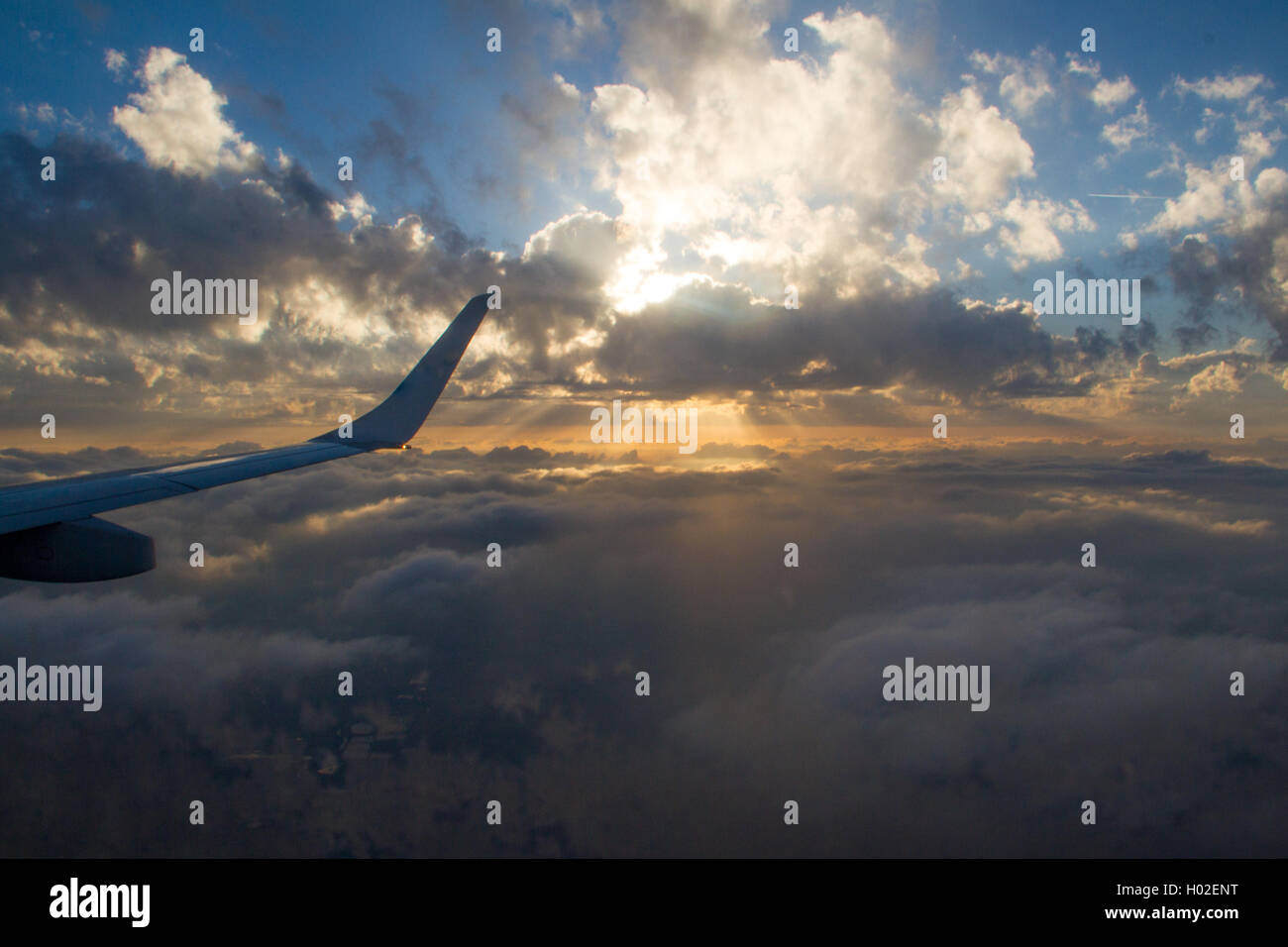 Sunset from airplane Stock Photo - Alamy