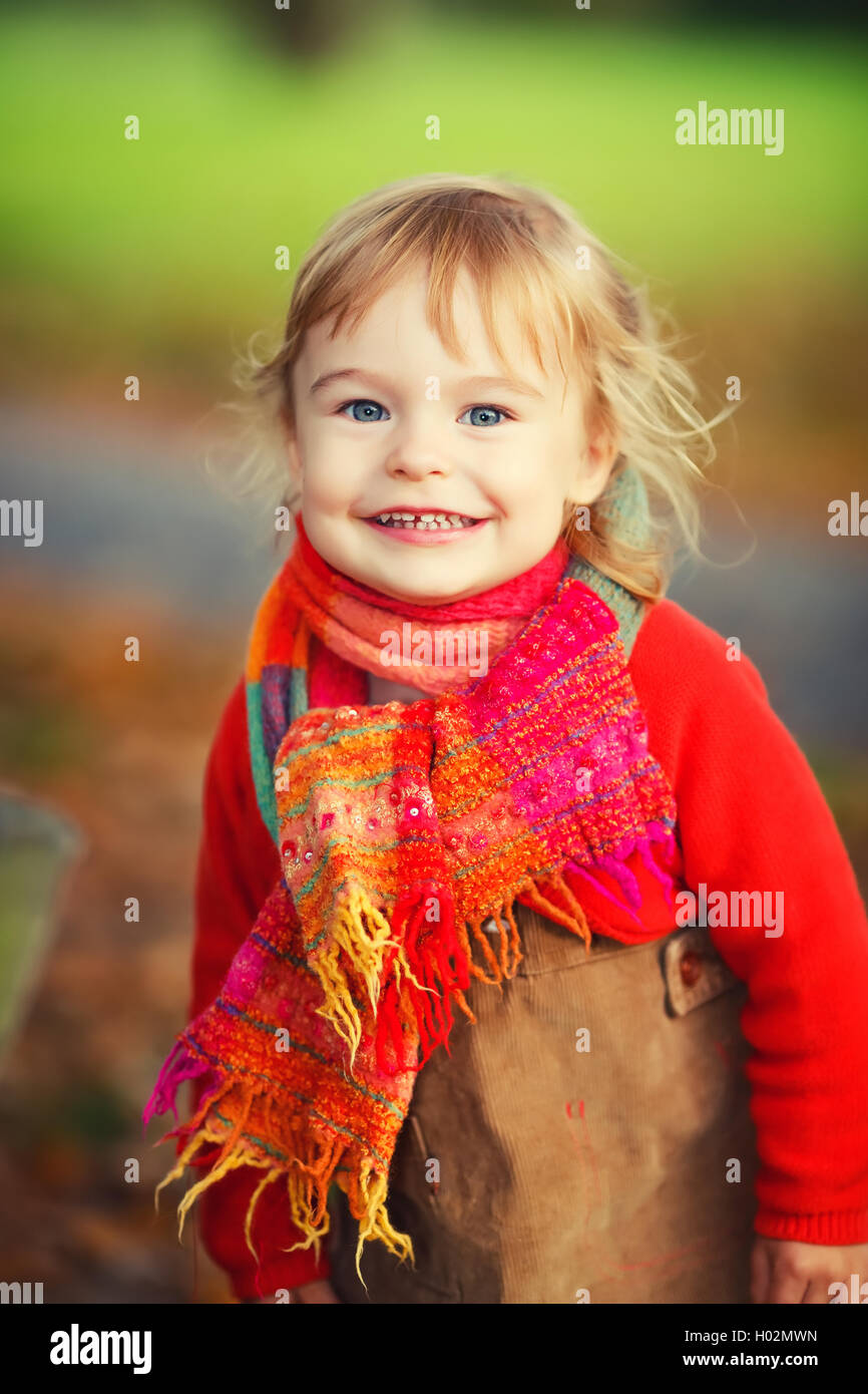 Happy little girl in the park Stock Photo - Alamy