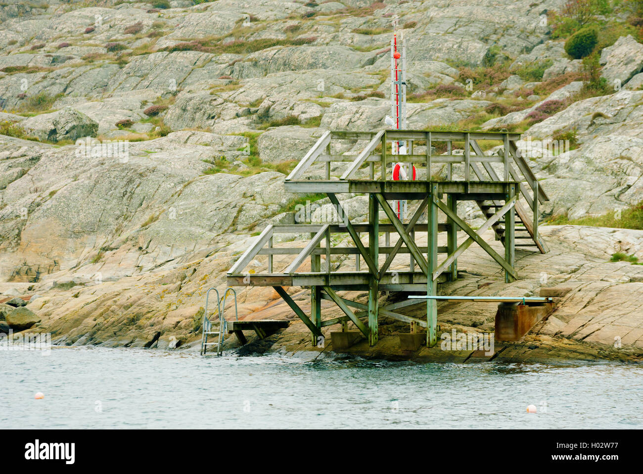 Wooden diving bridge or pier in coastal landscape Stock Photo - Alamy