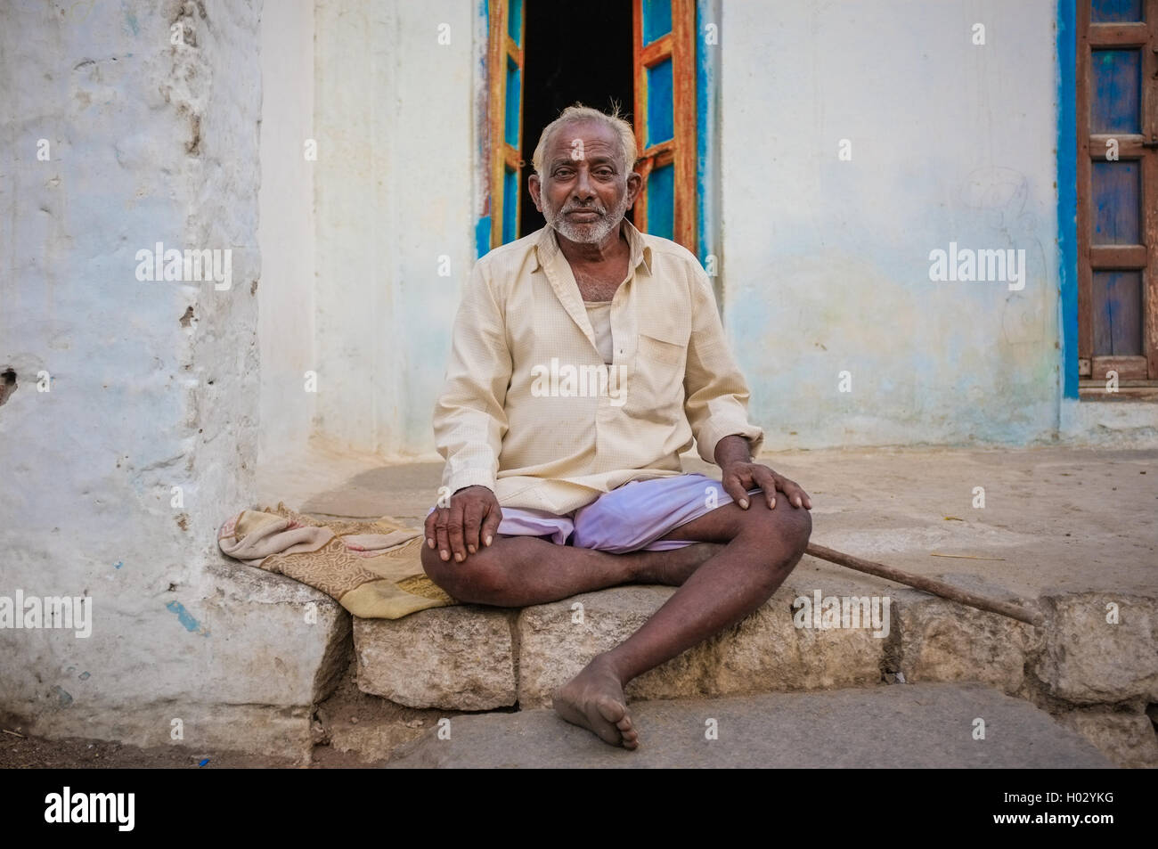 Indian man sitting cross legged hi-res stock photography and images - Alamy