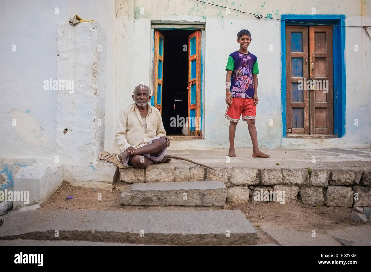Indian man sitting with his son hi-res stock photography and images - Alamy