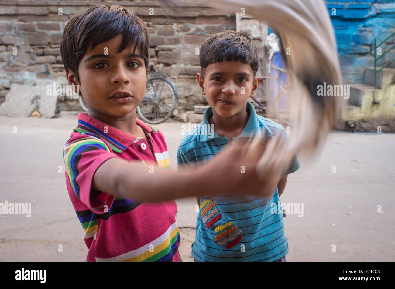 JODHPUR, INDIA - 17 FEBRUARY 2015: Two boys on street fool around with ...