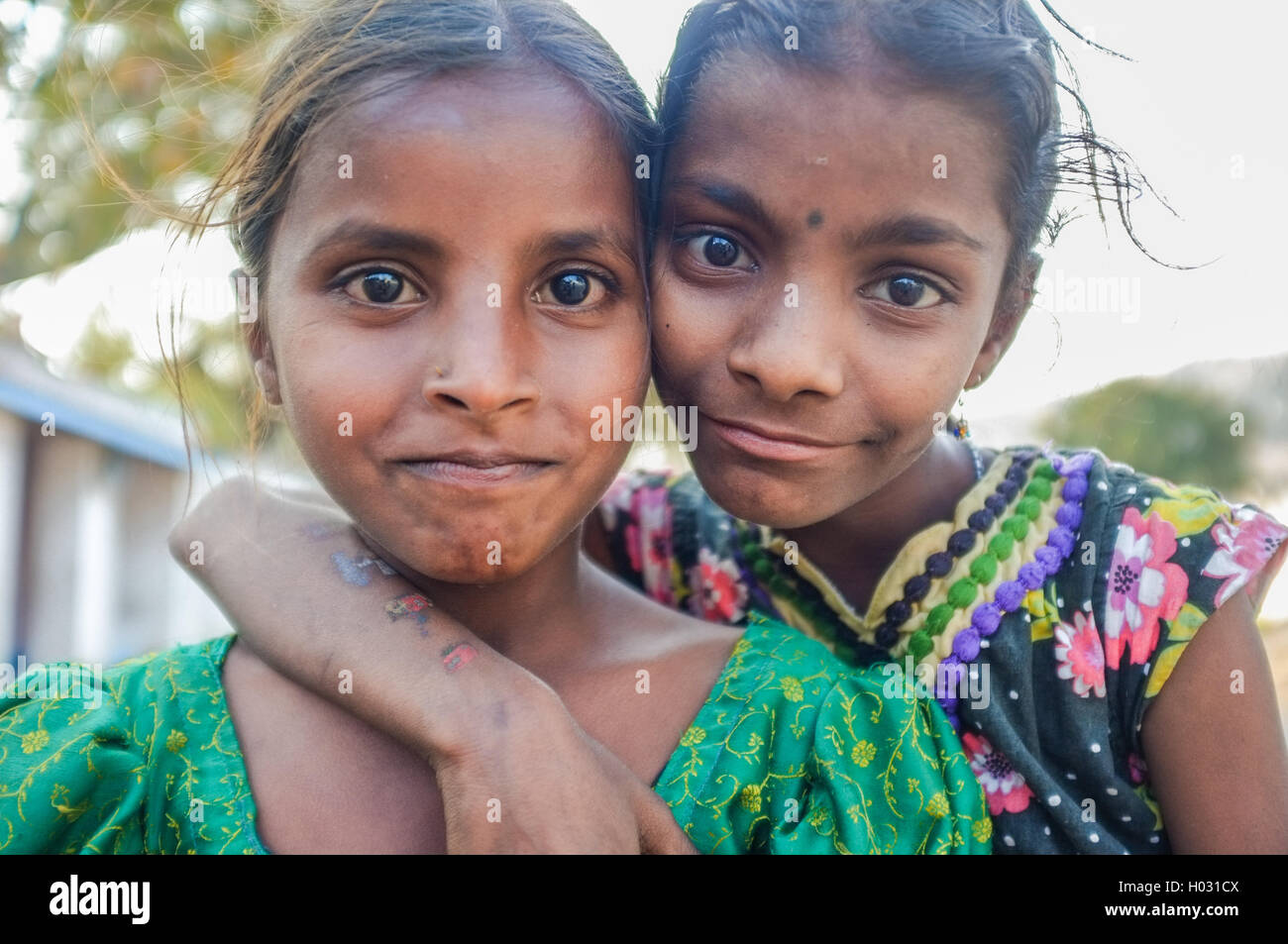 hAMPI, INDIA - 31 JANUARY 2015: Two Indian girls hugging and smiling ...