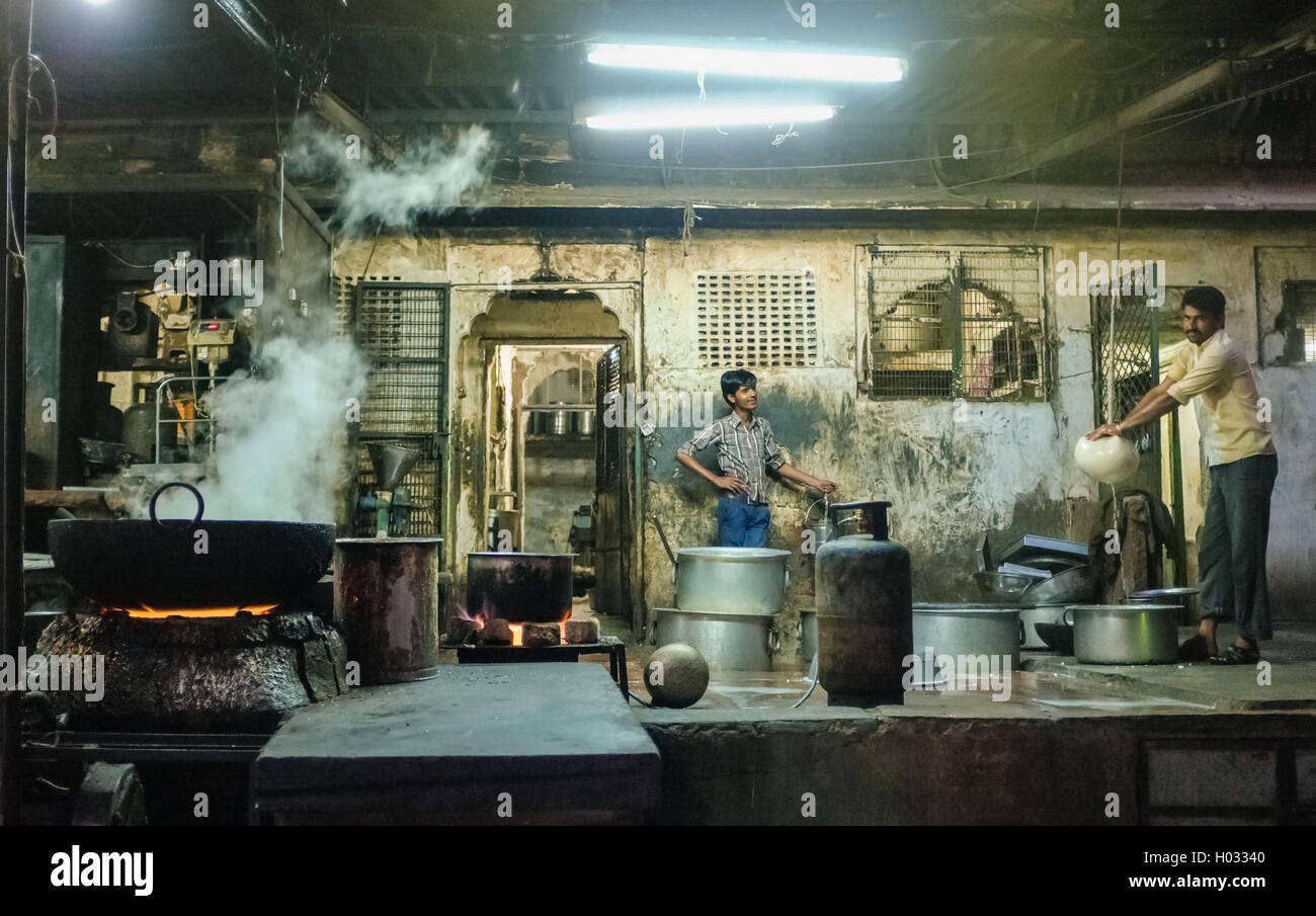 JODHPUR, INDIA - 07 FEBRUARY 2015: Two Indian workers in candy factory ...