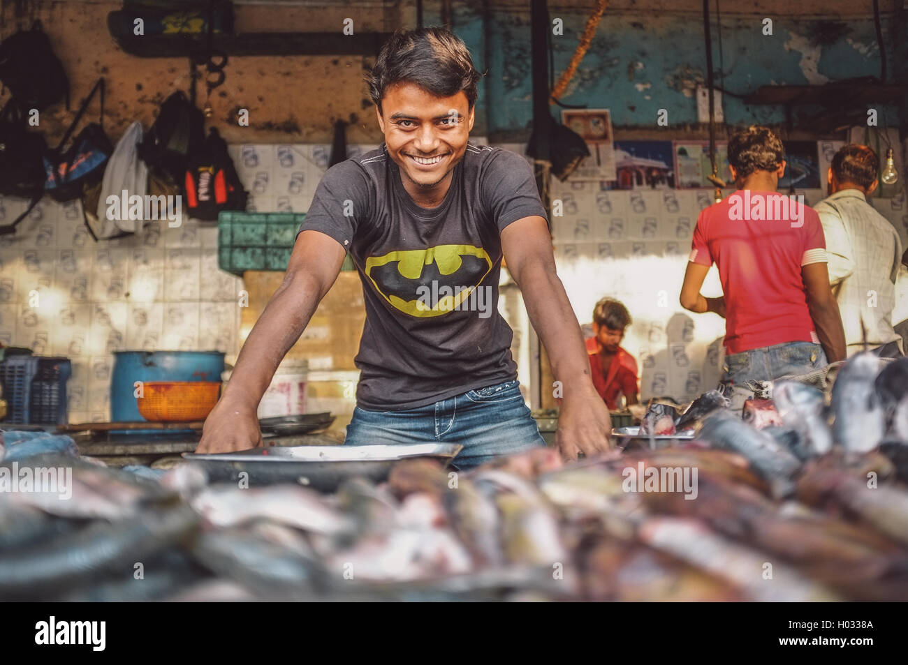 MUMBAI, INDIA - 08 JANUARY 2015: Worker on a fishmarket poses while ...
