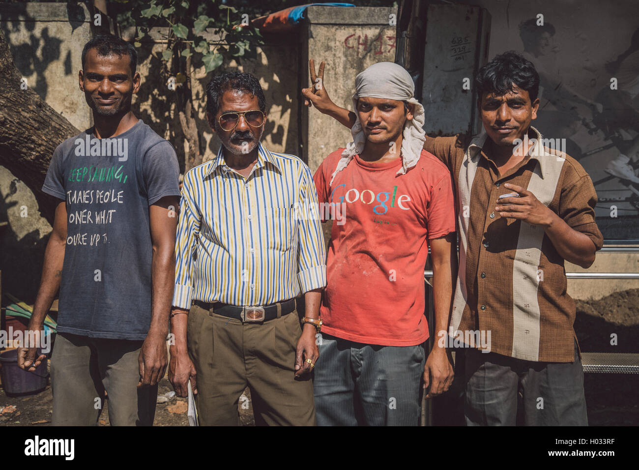 MUMBAI, INDIA - 09 JANUARY 2015: Three Indian men stand with ...