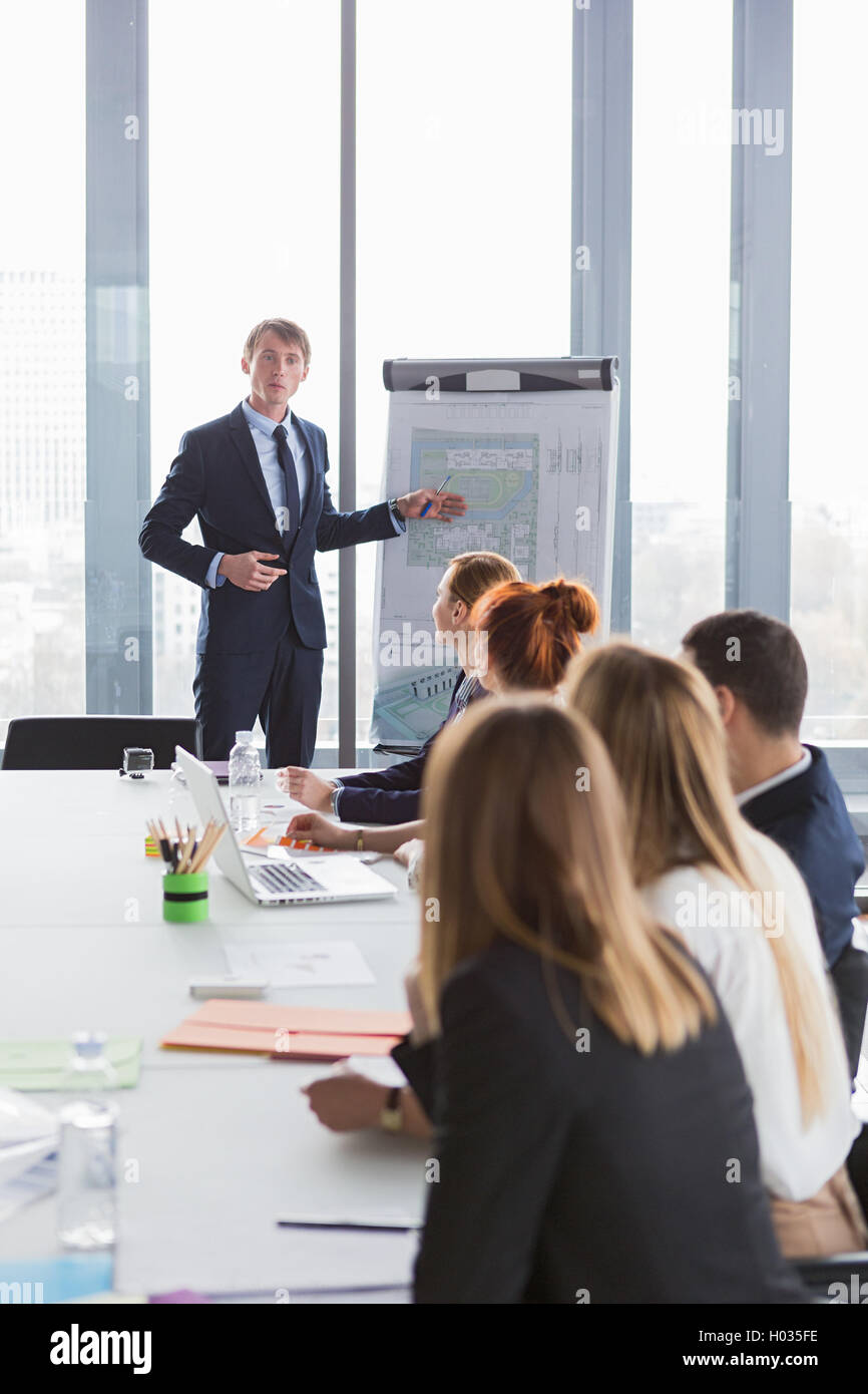 Business man showing plan team hi-res stock photography and images - Alamy