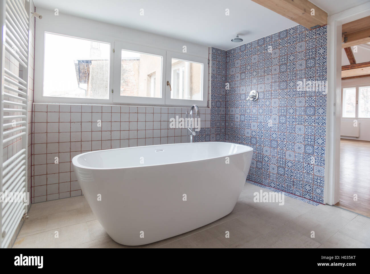 Interior of modern bathroom with free standing bath tub Stock Photo - Alamy