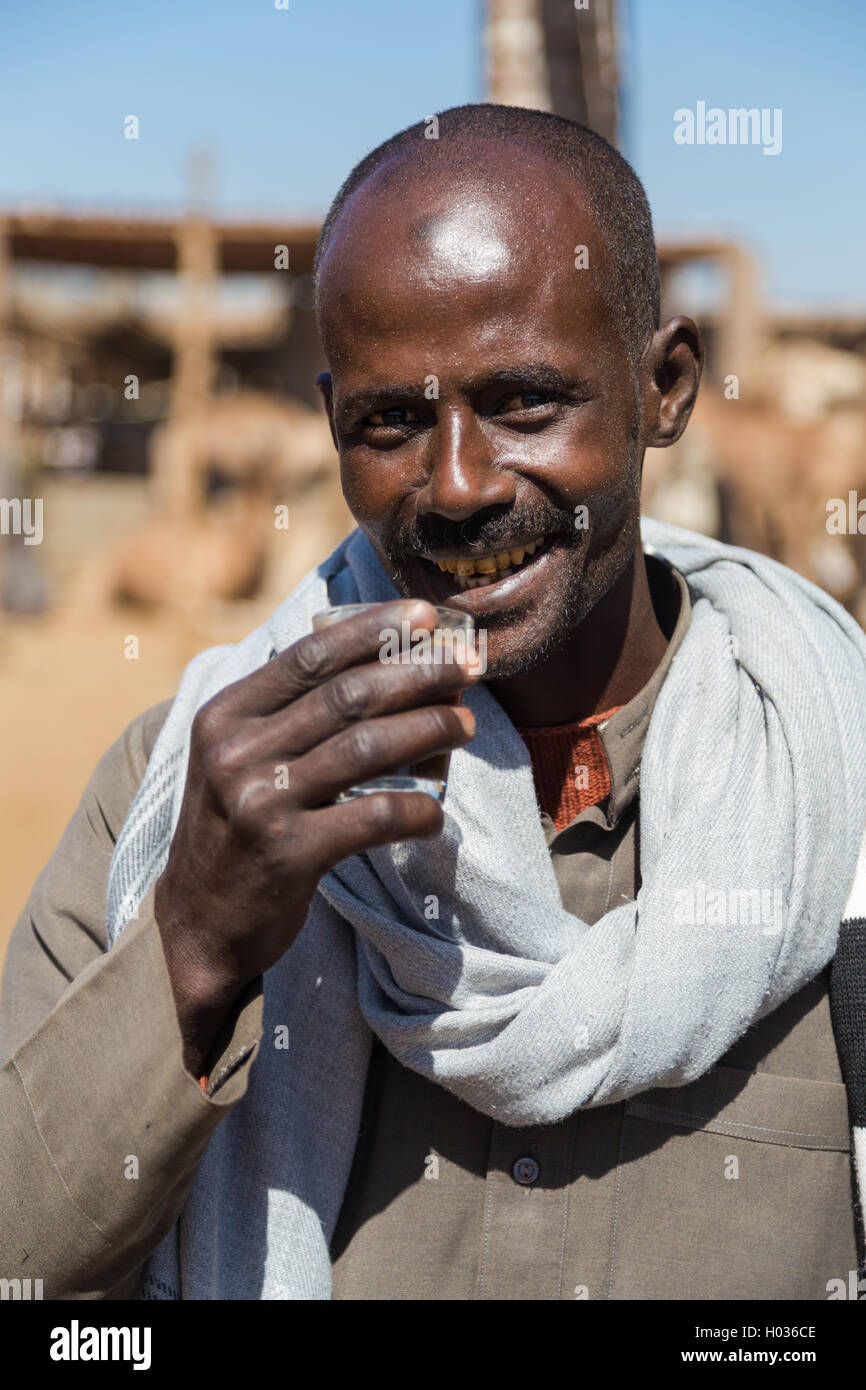 DARAW, EGYPT - FEBRUARY 6, 2016: Portrait of camel salesman drinking ...