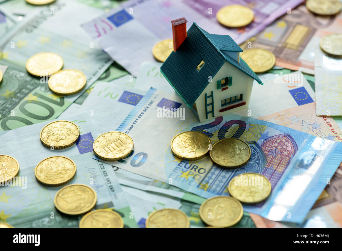house model on euro cash stack closeup Stock Photo - Alamy