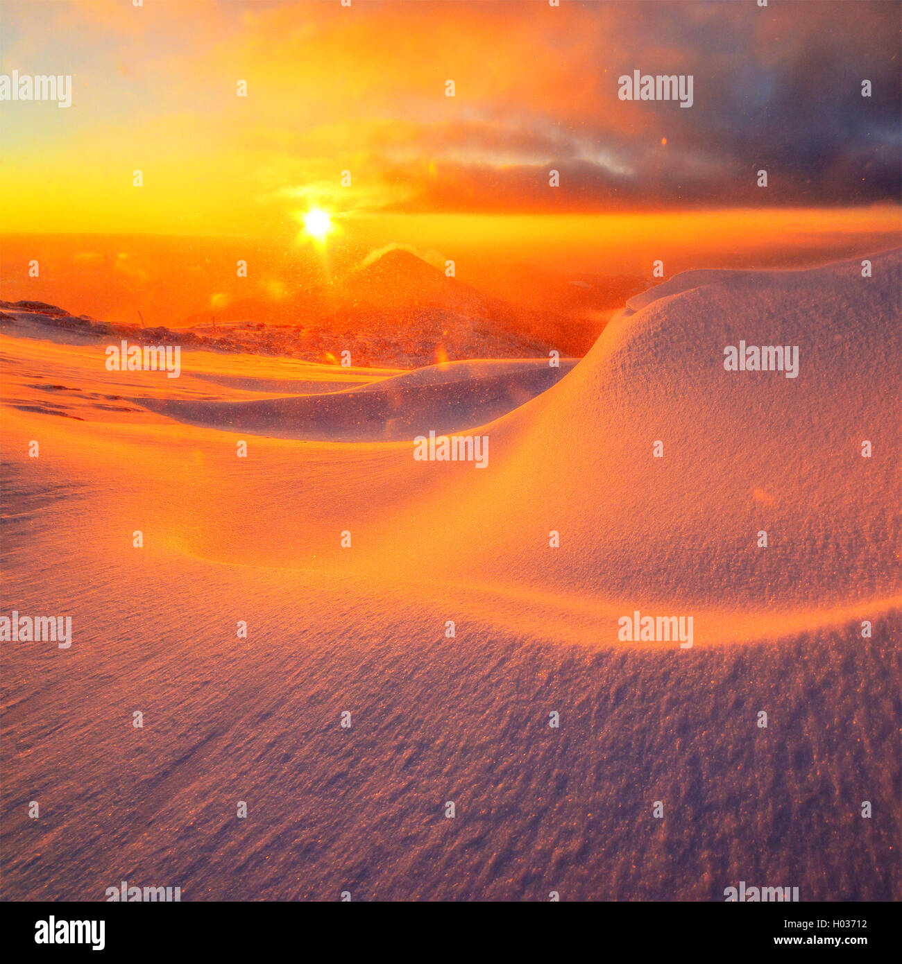 Fantastic orange evening landscape glowing by sunlight. Dramatic wintry ...