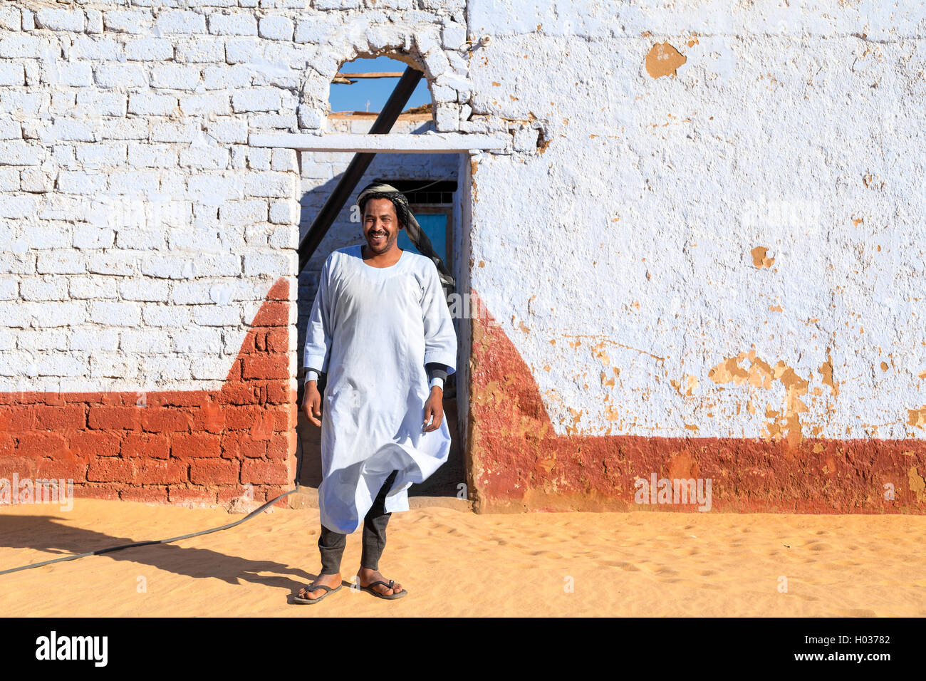 ASWAN, EGYPT - FEBRUARY 7, 2016: Nubian man wearing traditional clothing standing in front of ...
