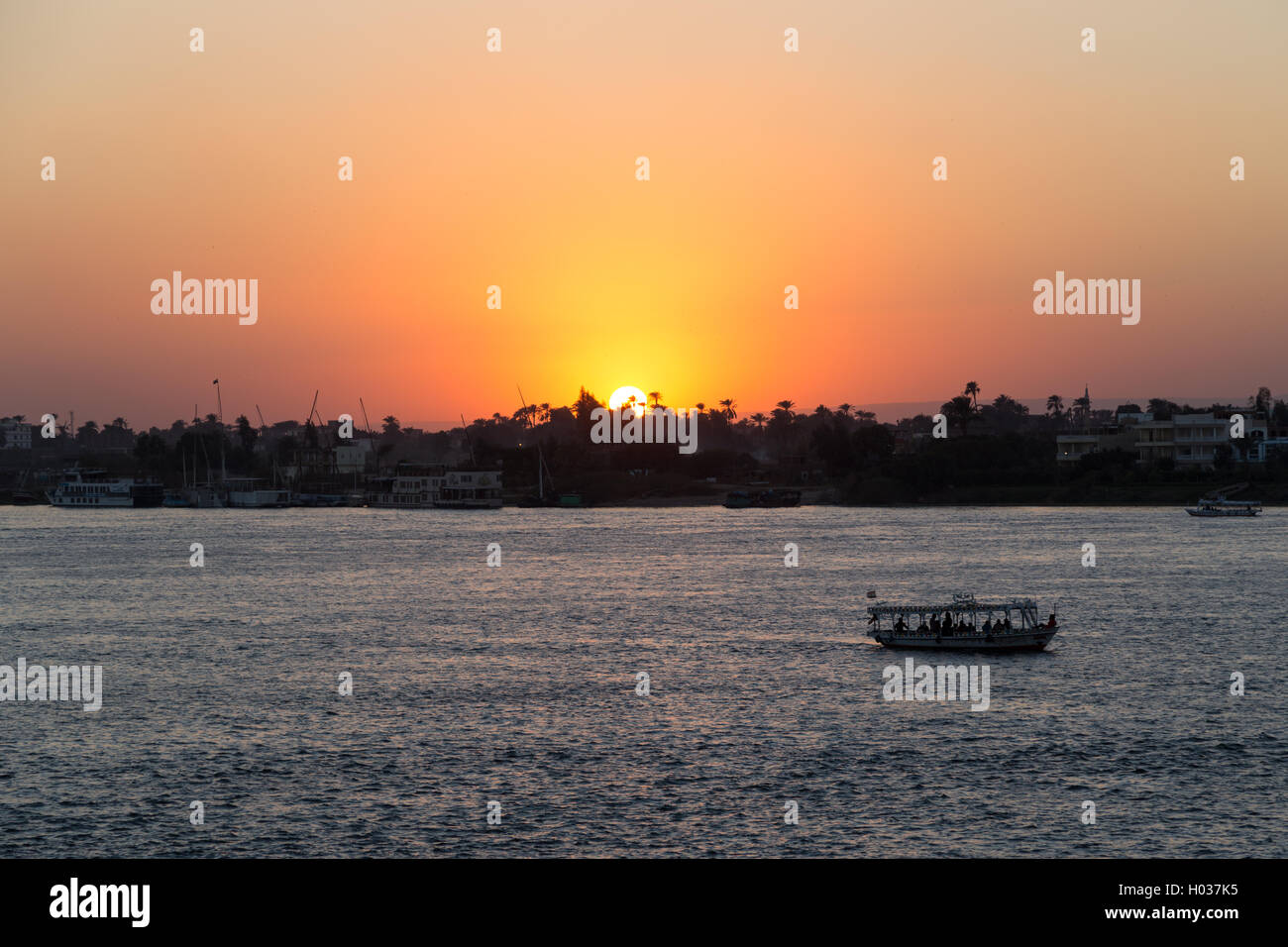 Tourist sailboat at Luxor waterfront during sunset Stock Photo - Alamy