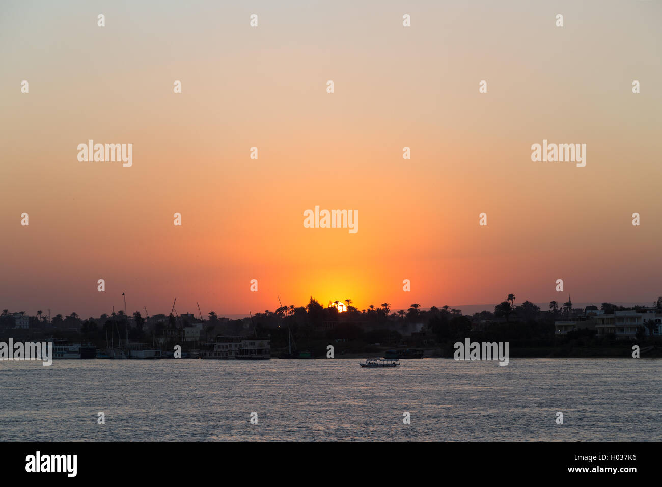 Tourist sailboat at Luxor waterfront during sunset Stock Photo - Alamy