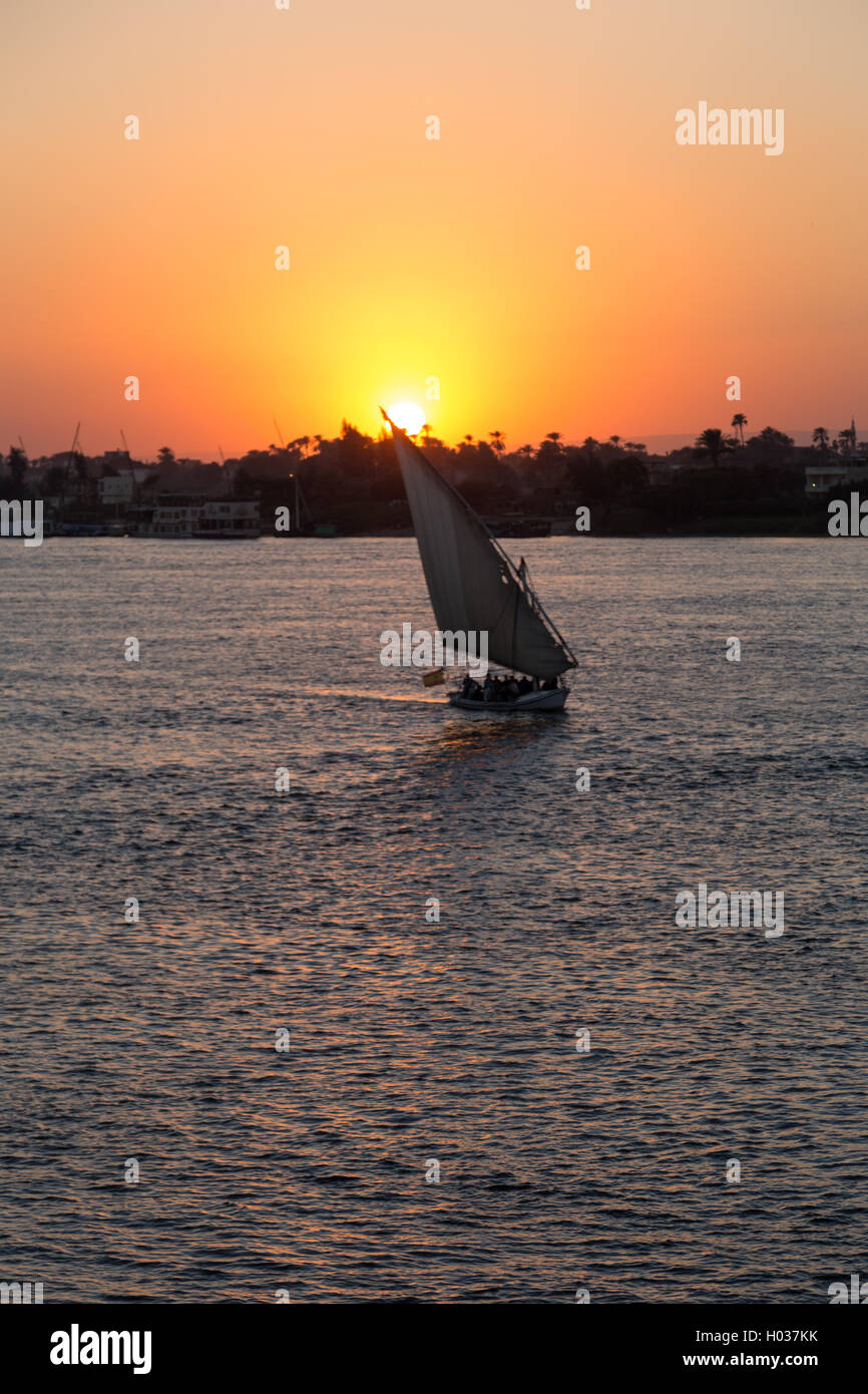 Tourist sailboat at Luxor waterfront during sunset Stock Photo - Alamy