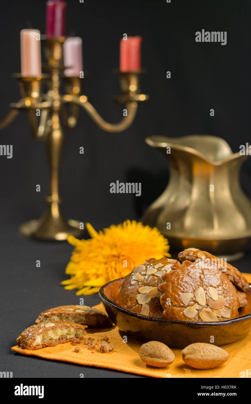 Dutch marzipan filled cookies with almonds on autumn colored and dark ...