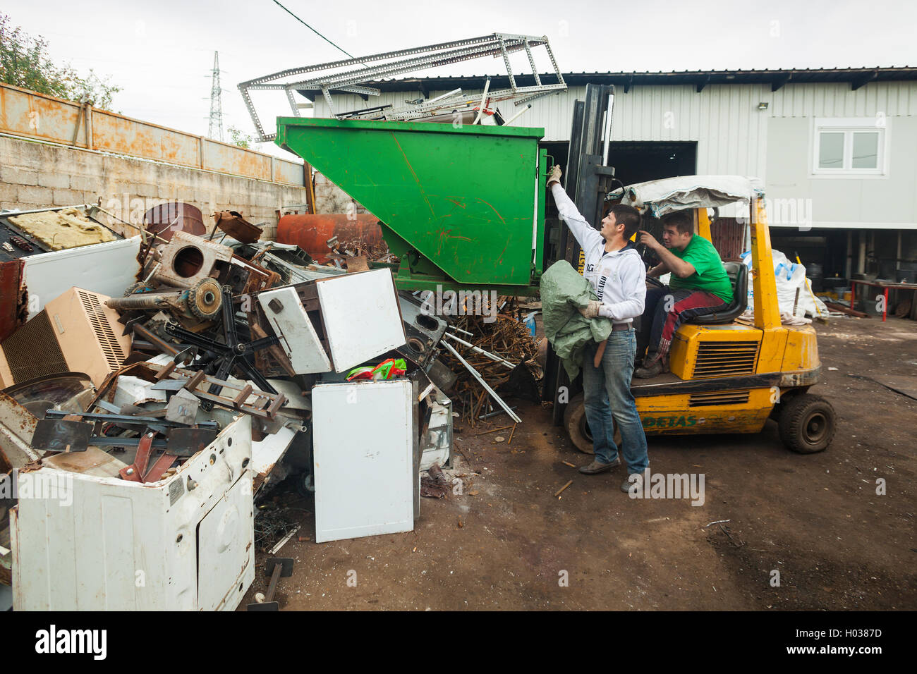 Worker collecting scrap metal hi-res stock photography and images - Alamy