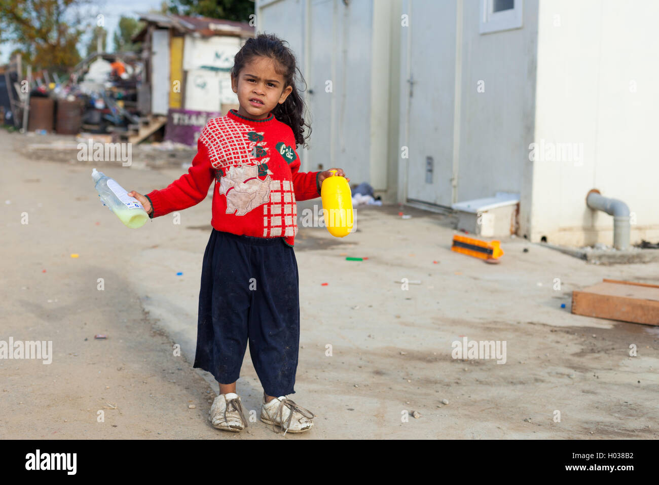 ZAGREB, CROATIA - OCTOBER 21, 2013: Cute little Roma girl playing with ...