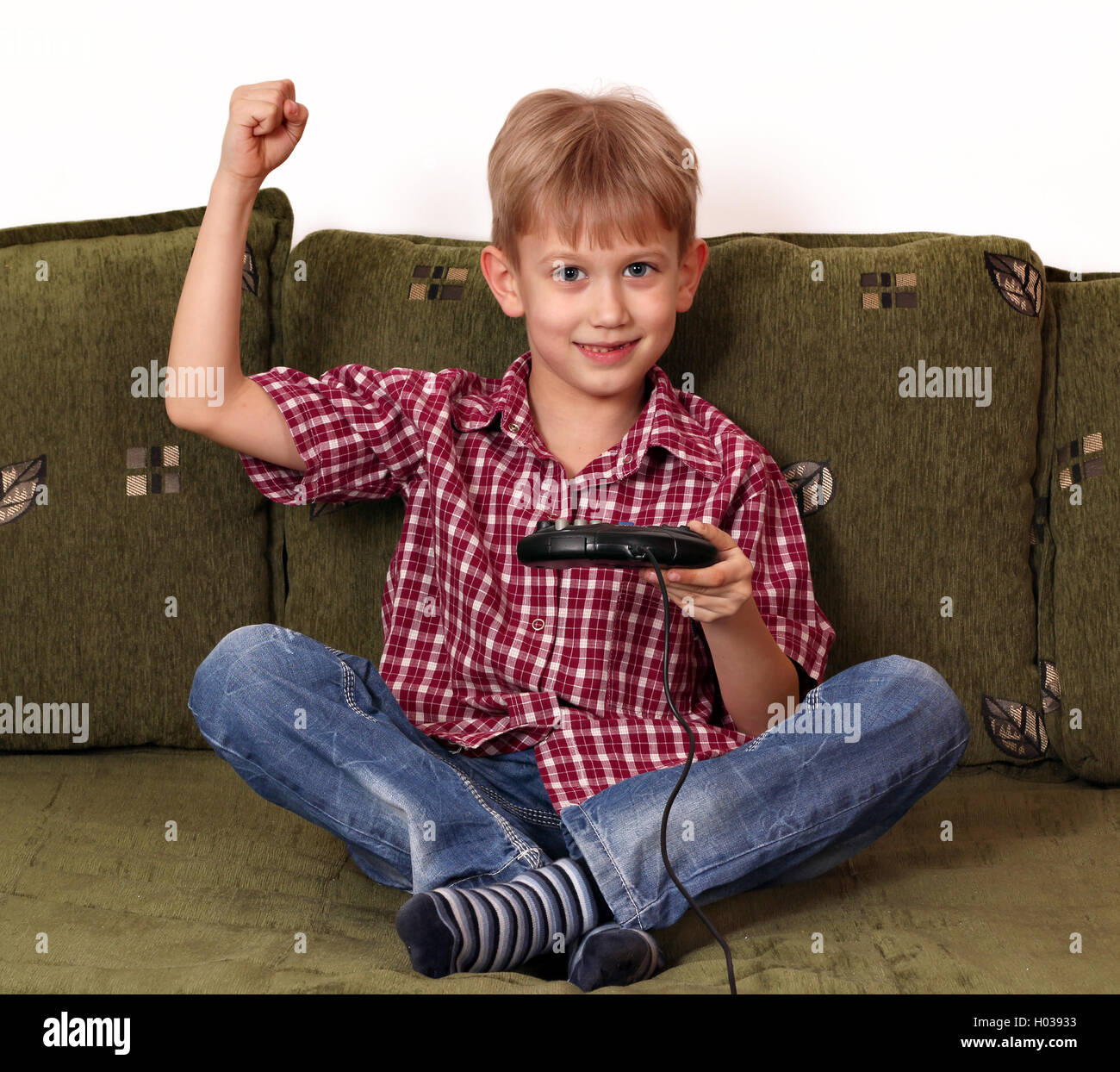 happy boy play video game Stock Photo - Alamy