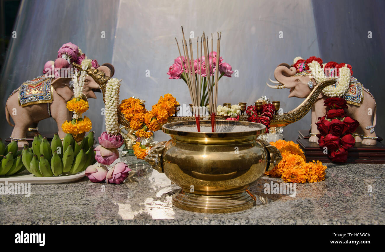 Offerings in a shrine Stock Photo - Alamy