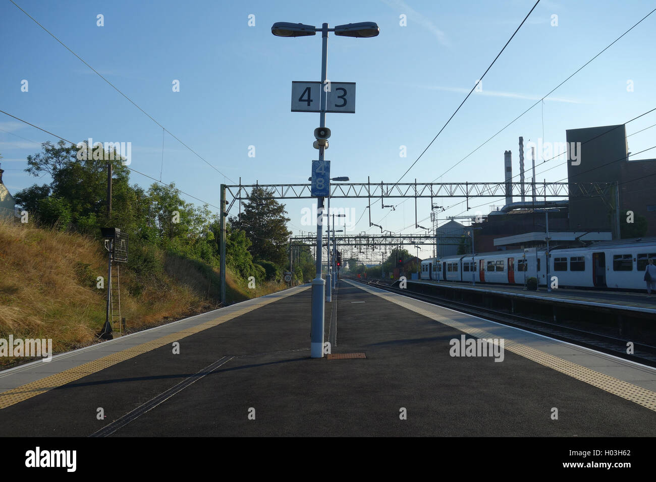 Witham railway station platform and train Stock Photo - Alamy