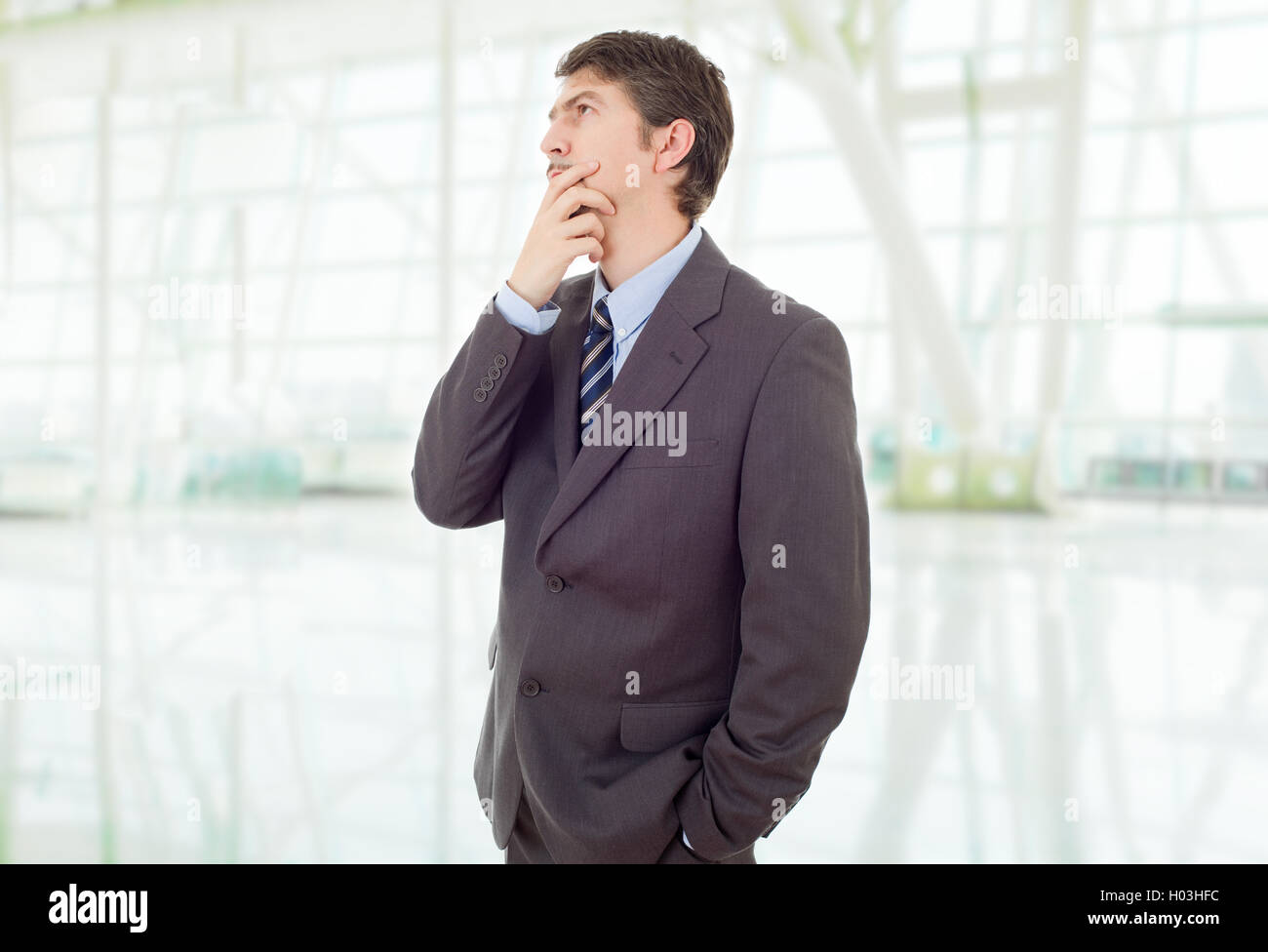 young business man thinking, at the office Stock Photo - Alamy