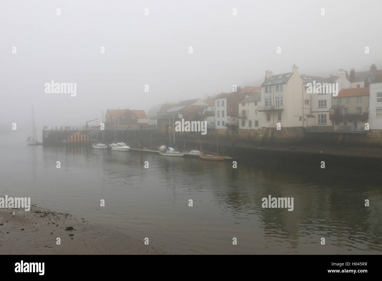 Whitby harbour on a foggy day Stock Photo - Alamy