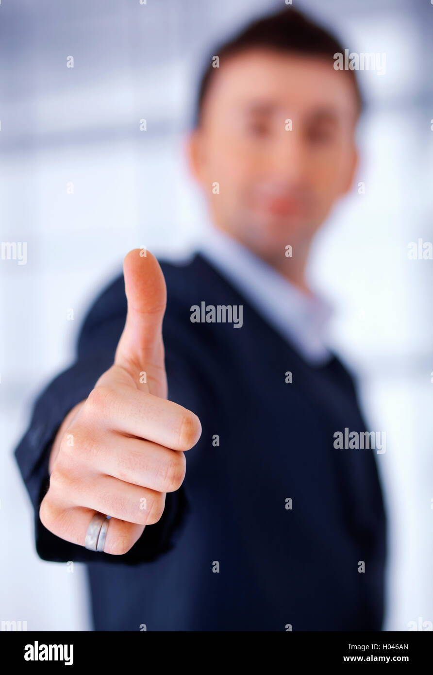 Close up portrait of a hand gesturing thumb up Stock Photo - Alamy