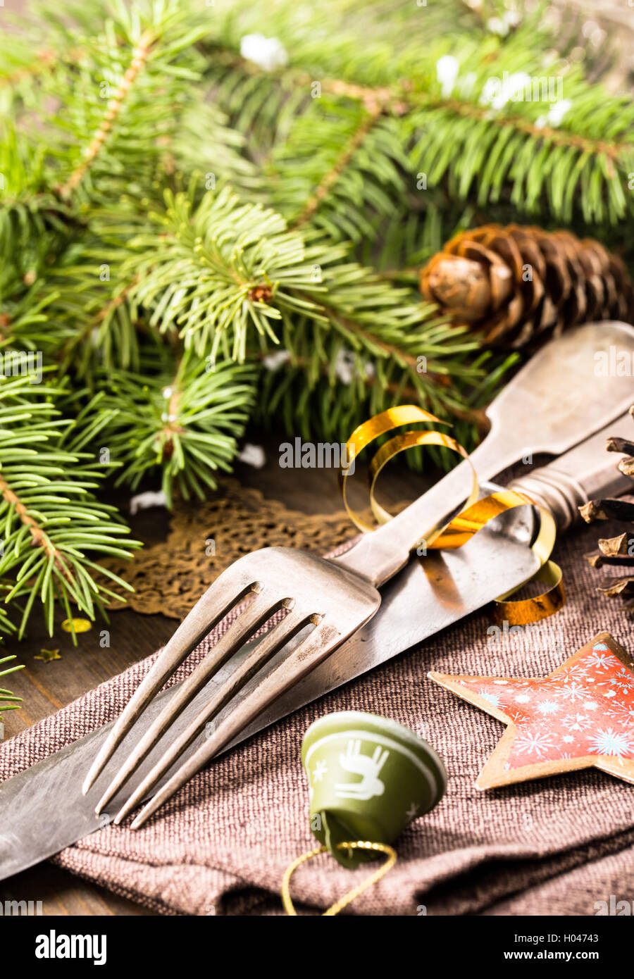 Vintage silverware and Christmas decorations around Stock Photo - Alamy