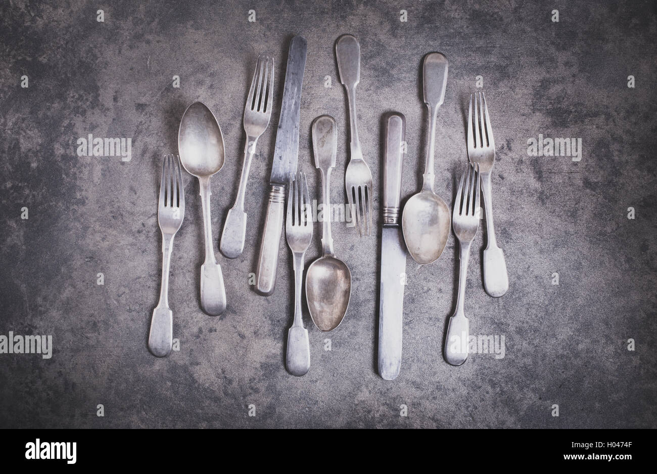 Vintage silverware on grunge background top view Stock Photo - Alamy