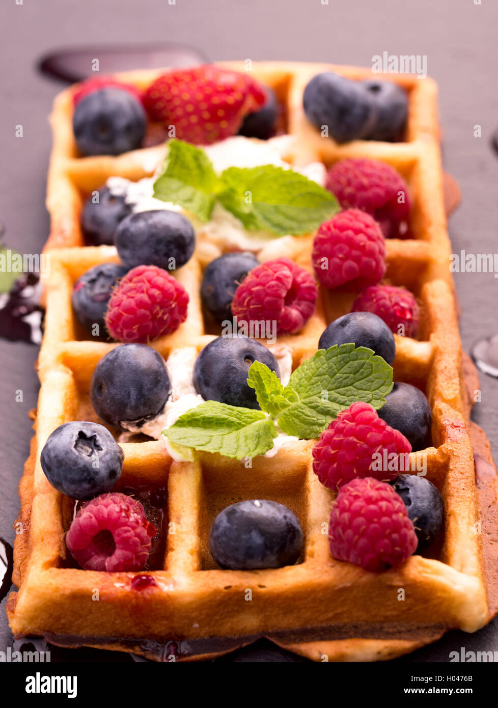 Waffles with blueberry and raspberry Stock Photo - Alamy