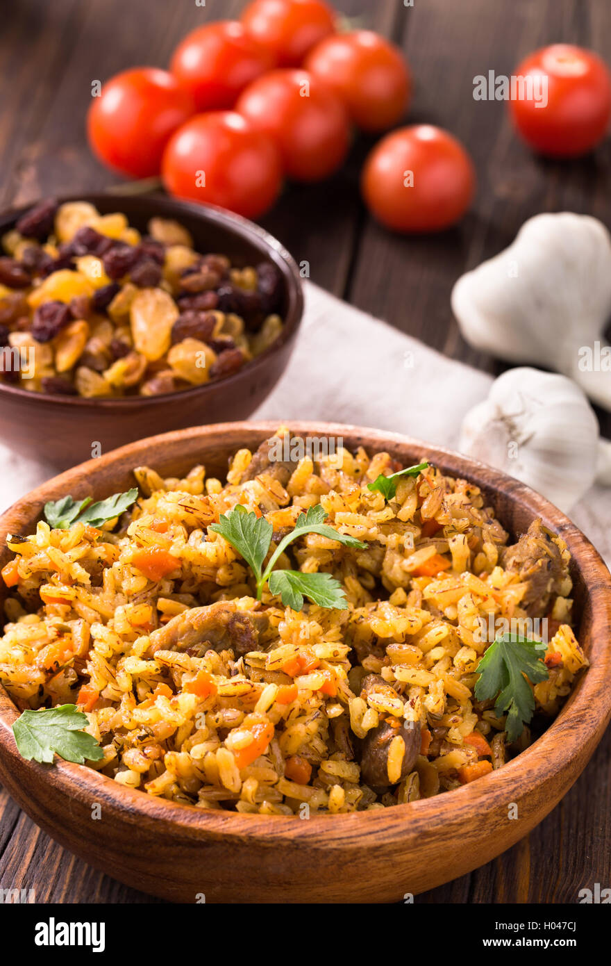 Wooden bowl of pilaf Stock Photo - Alamy