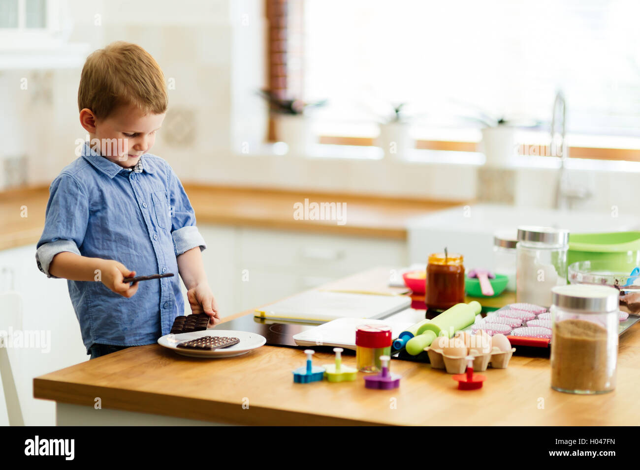 Cute child learning to become a chef since the age of 2 Stock Photo - Alamy