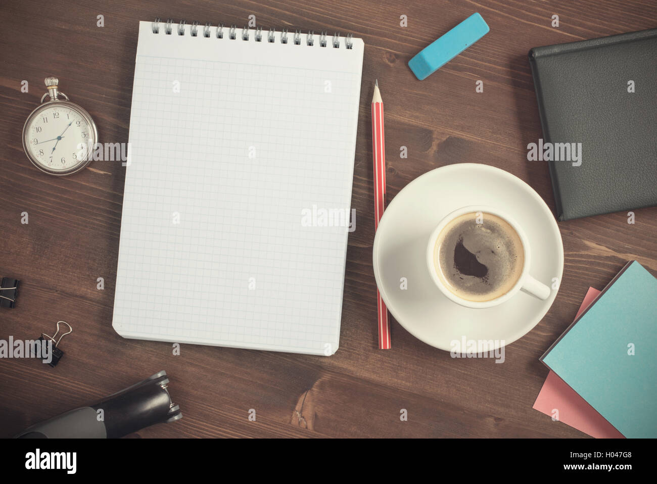 Work desk with notebook and coffee Stock Photo - Alamy